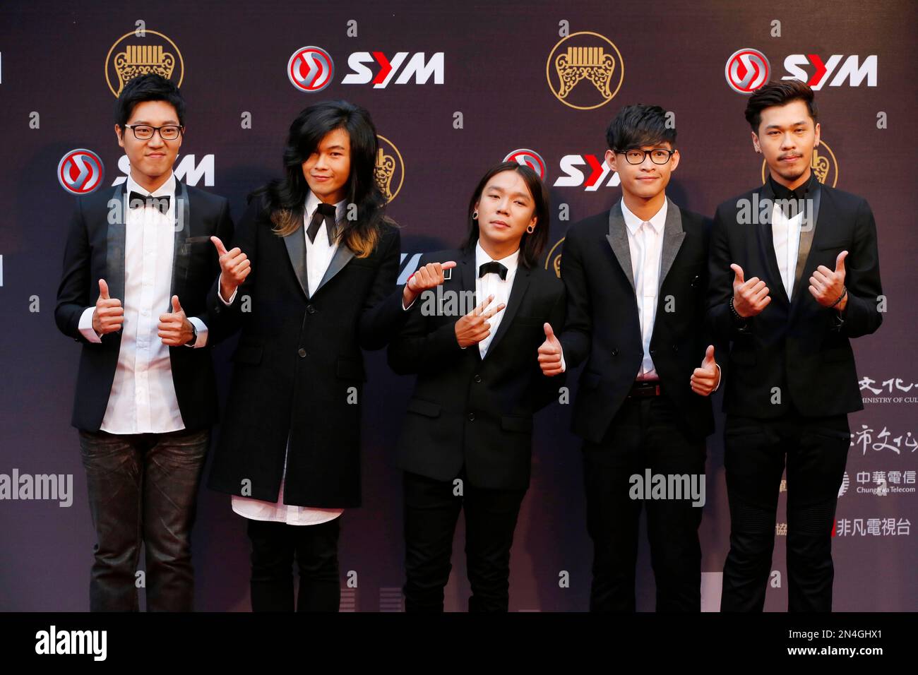 Taiwanese pop group Mixer pose for photos upon arrival at the 25th ...