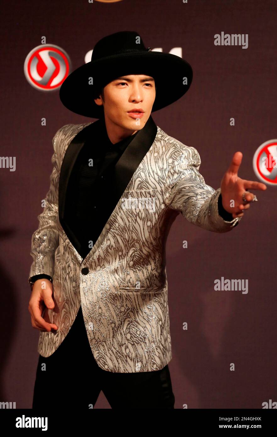 Taiwanese singer Jam Hsiao poses for photos upon arrival at the 25th ...