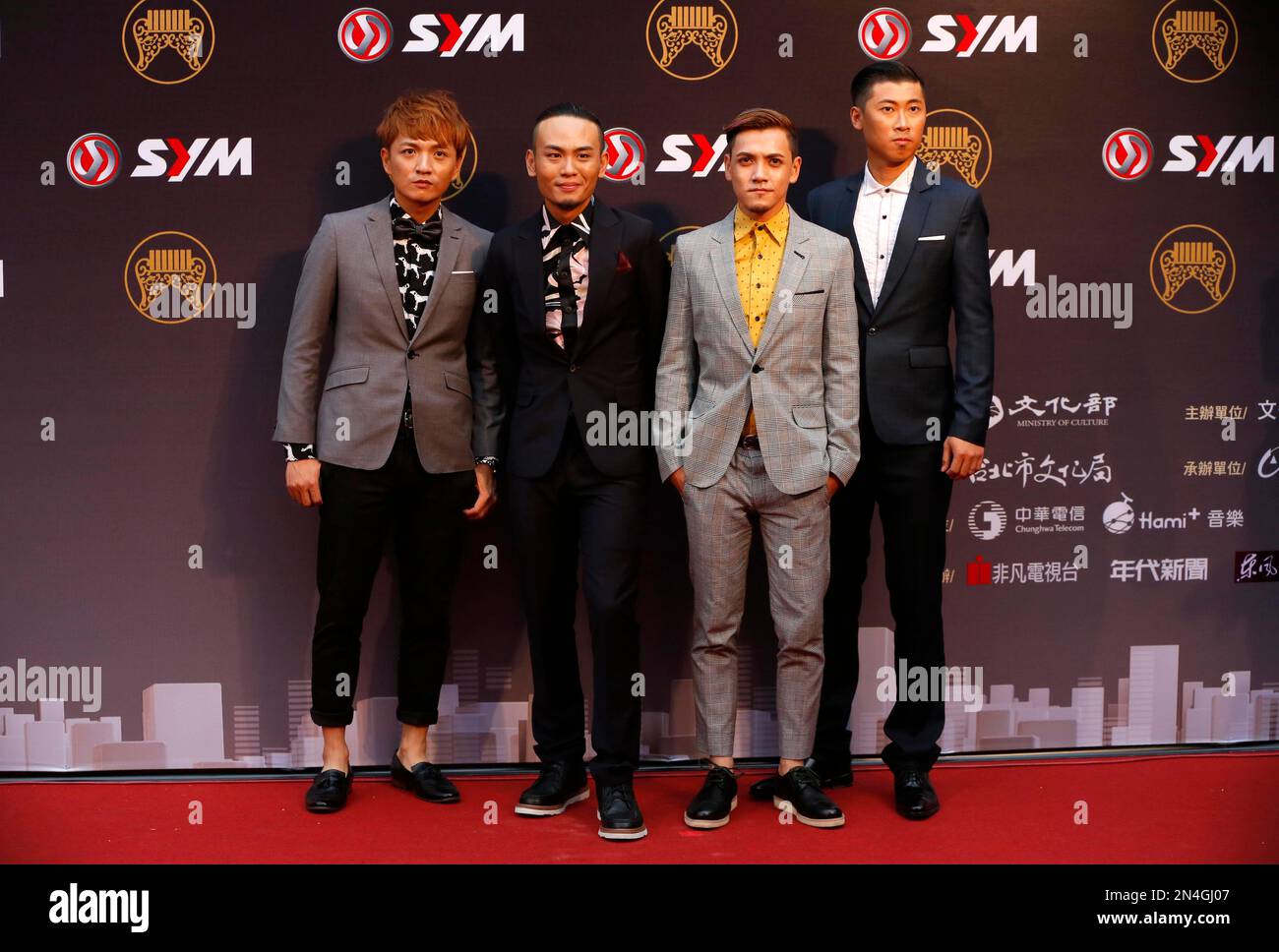 Taiwanese pop group FIRE EX. pose for photos upon arrival at the 25th ...