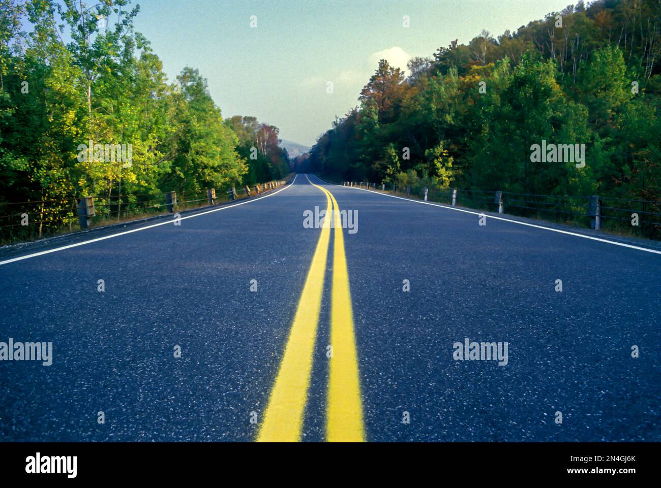 YELLOW CENTER DIVIDING LINES EMPTY ROAD VERMONT USA Stock Photo - Alamy