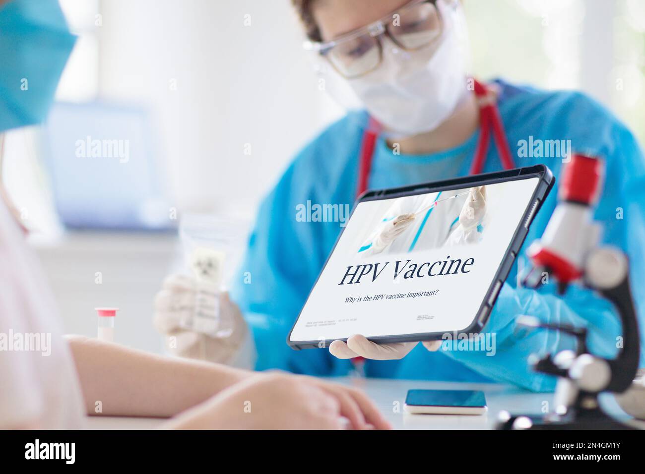 Girl getting vaccine. HPV vaccination for young girls. Doctor giving ...