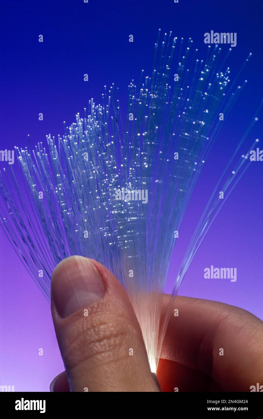 WOMANS HANDS HOLDING FIBER OPTIC STRANDS (©KECK MAURER & SCHULTZ ...