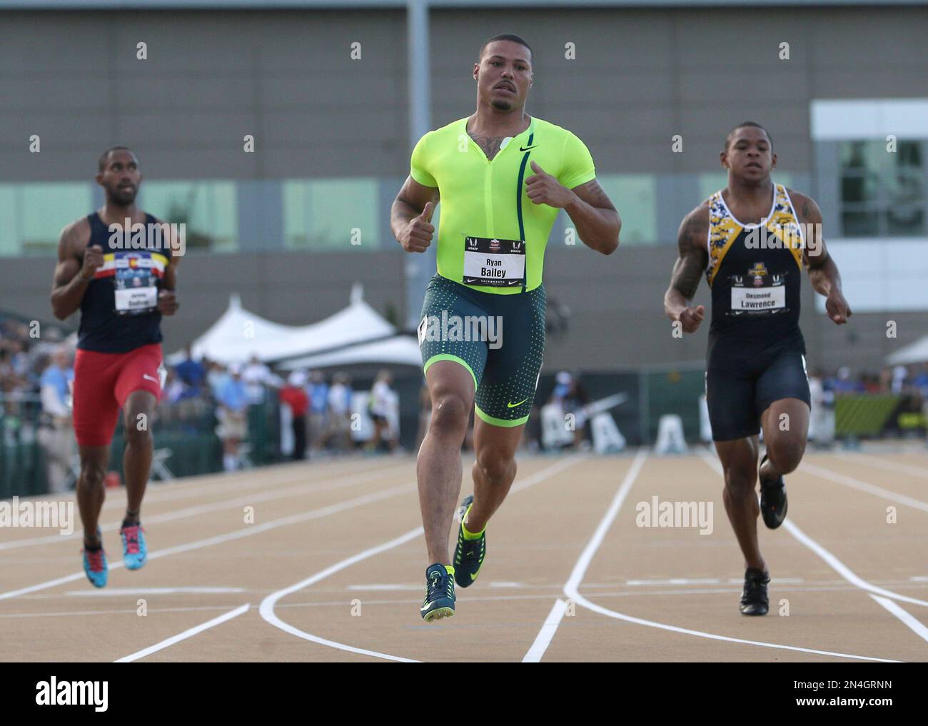 Ryan Bailey, center, crossrd the finish line as he wins a quarterfinal ...