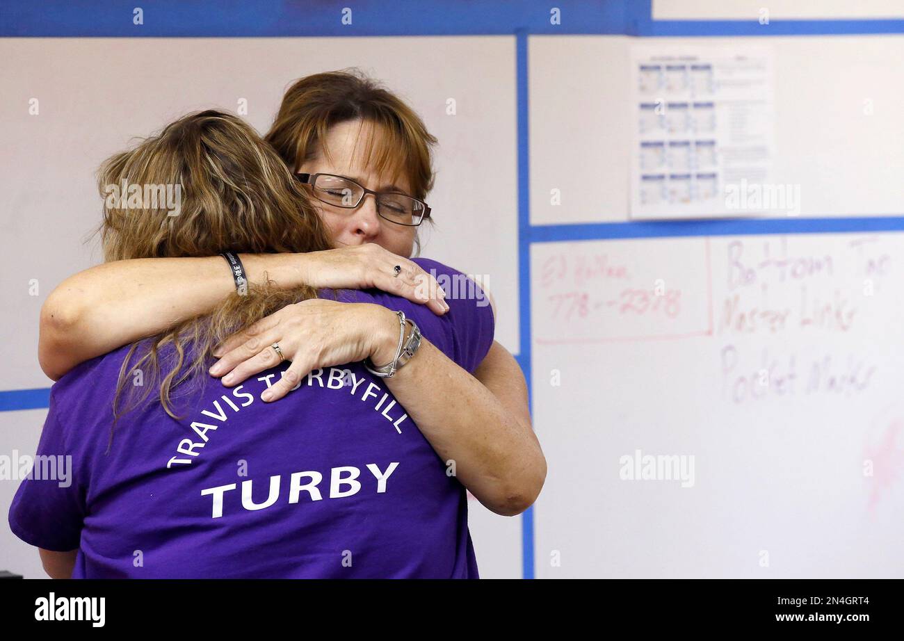 Colleen Turbyfill, left, Travis Turbyfill's mother, and Michelle Parker ...