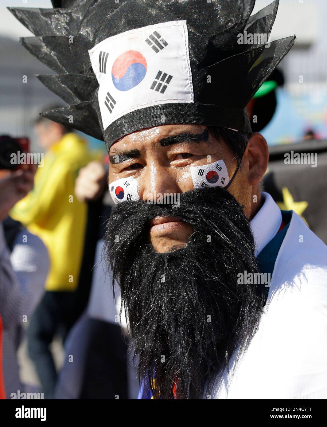 A South Korean fan wearing the traditional dress, arrives before the ...