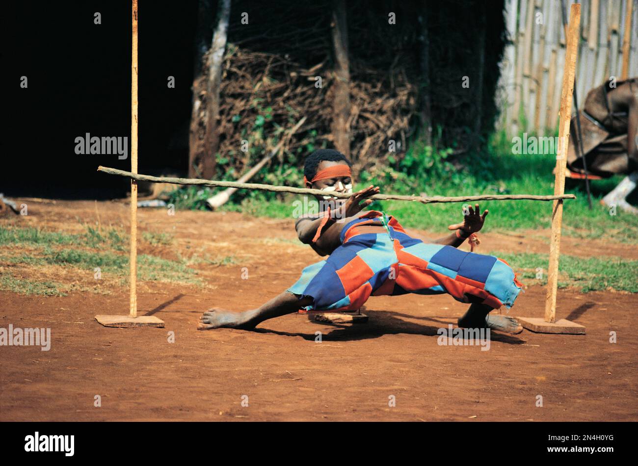 Kenya. Boy Limbo dancing Stock Photo - Alamy