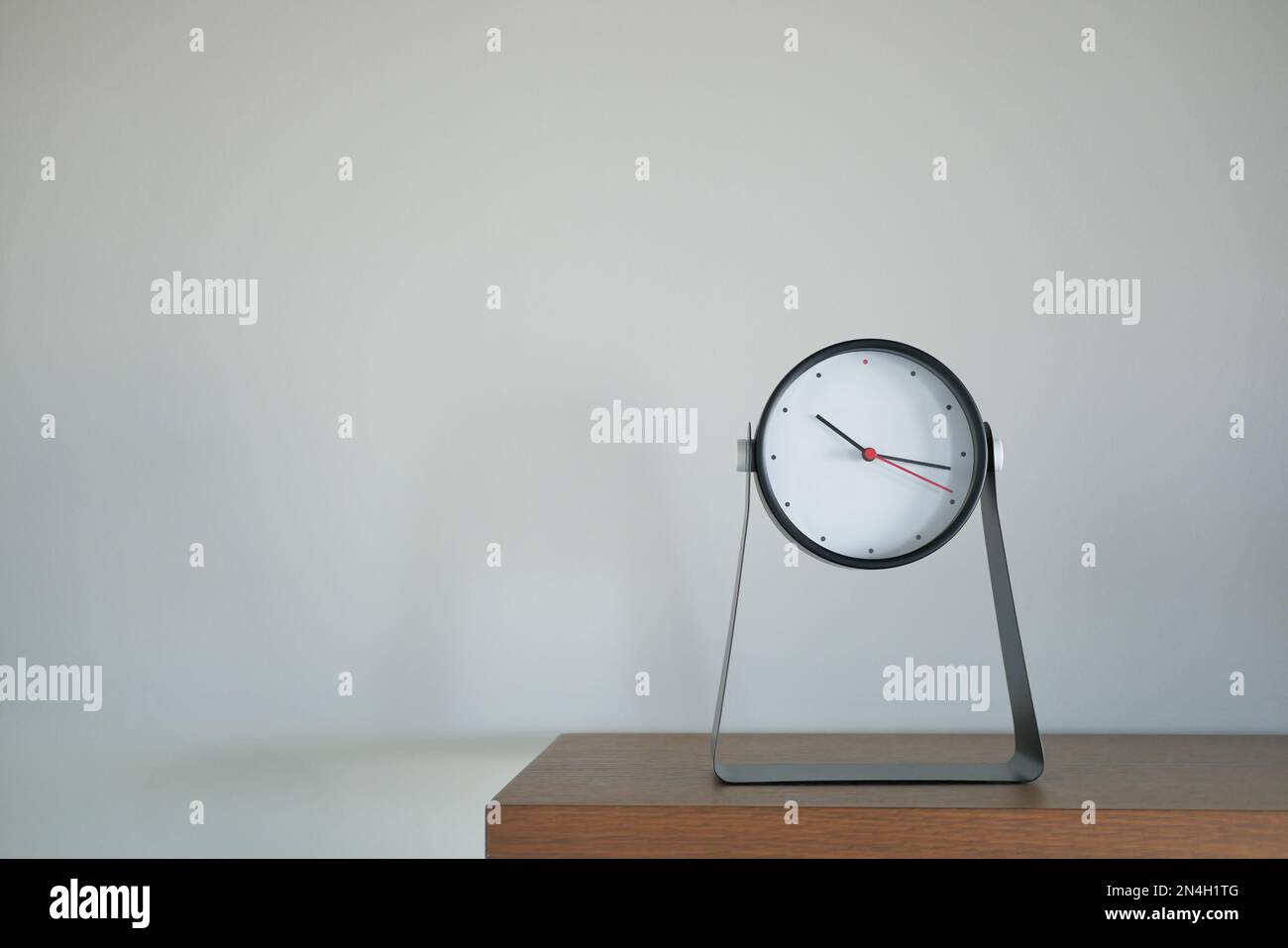 Round clock isolated on white background Stock Photo - Alamy