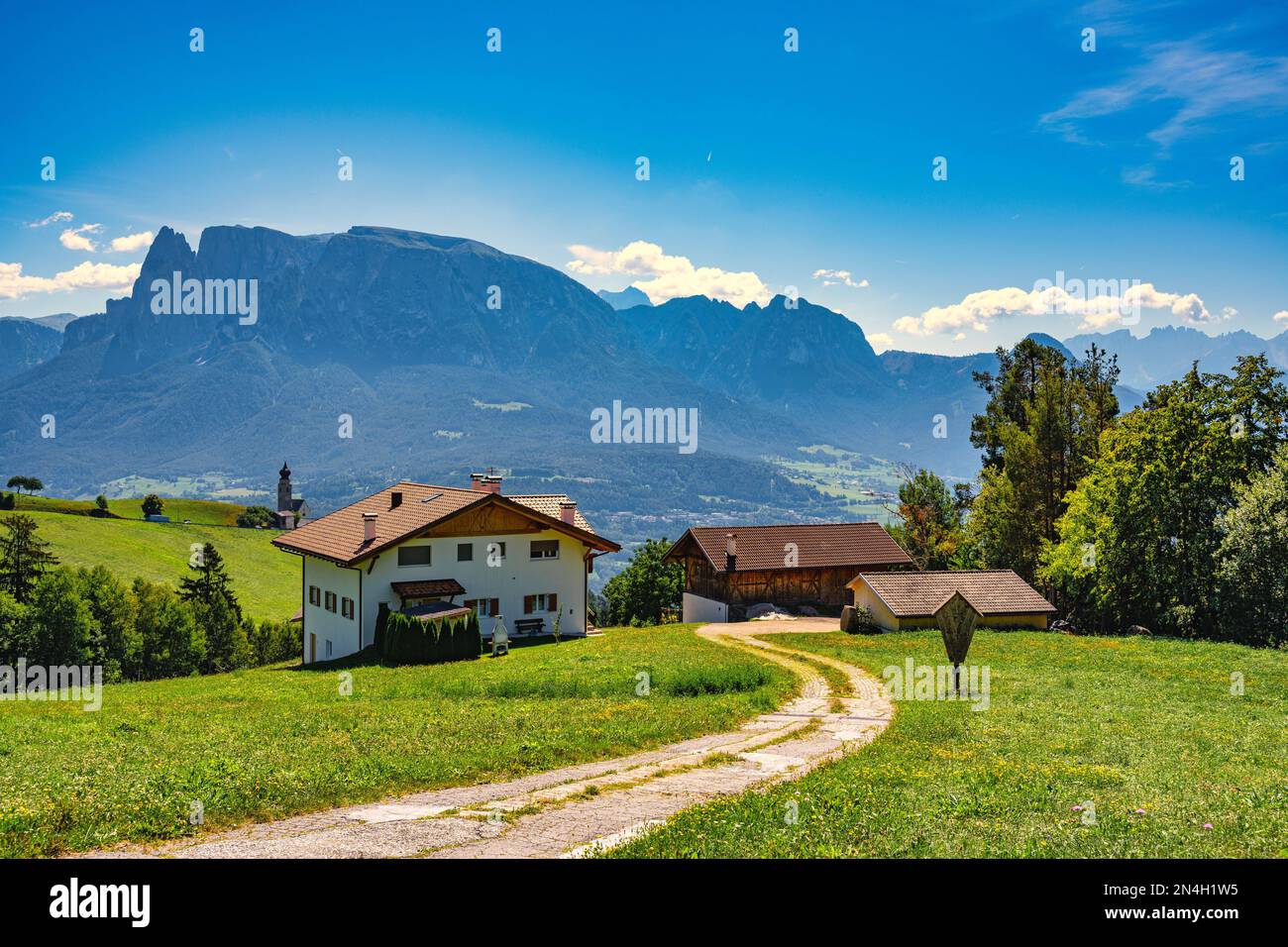 A beautiful view of pathway to the houses on a mountain background ...