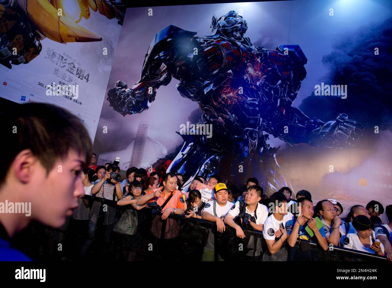 In this Monday June 23, 2014 photo, Chinese fans wait to see movie ...