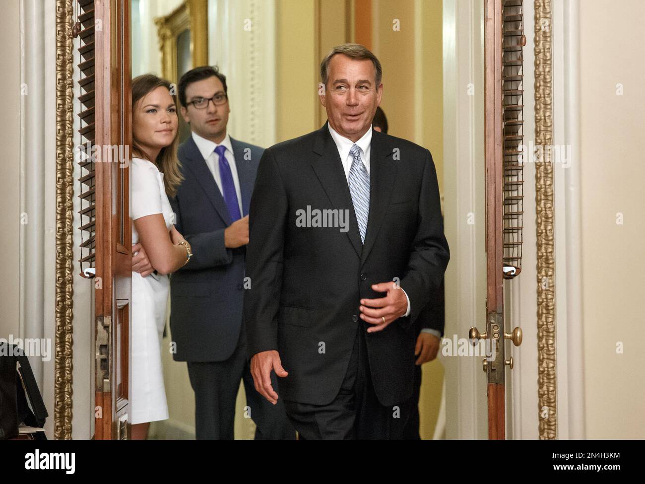 Speaker of the House John Boehner, R-Ohio, smiles as he arrives to ...