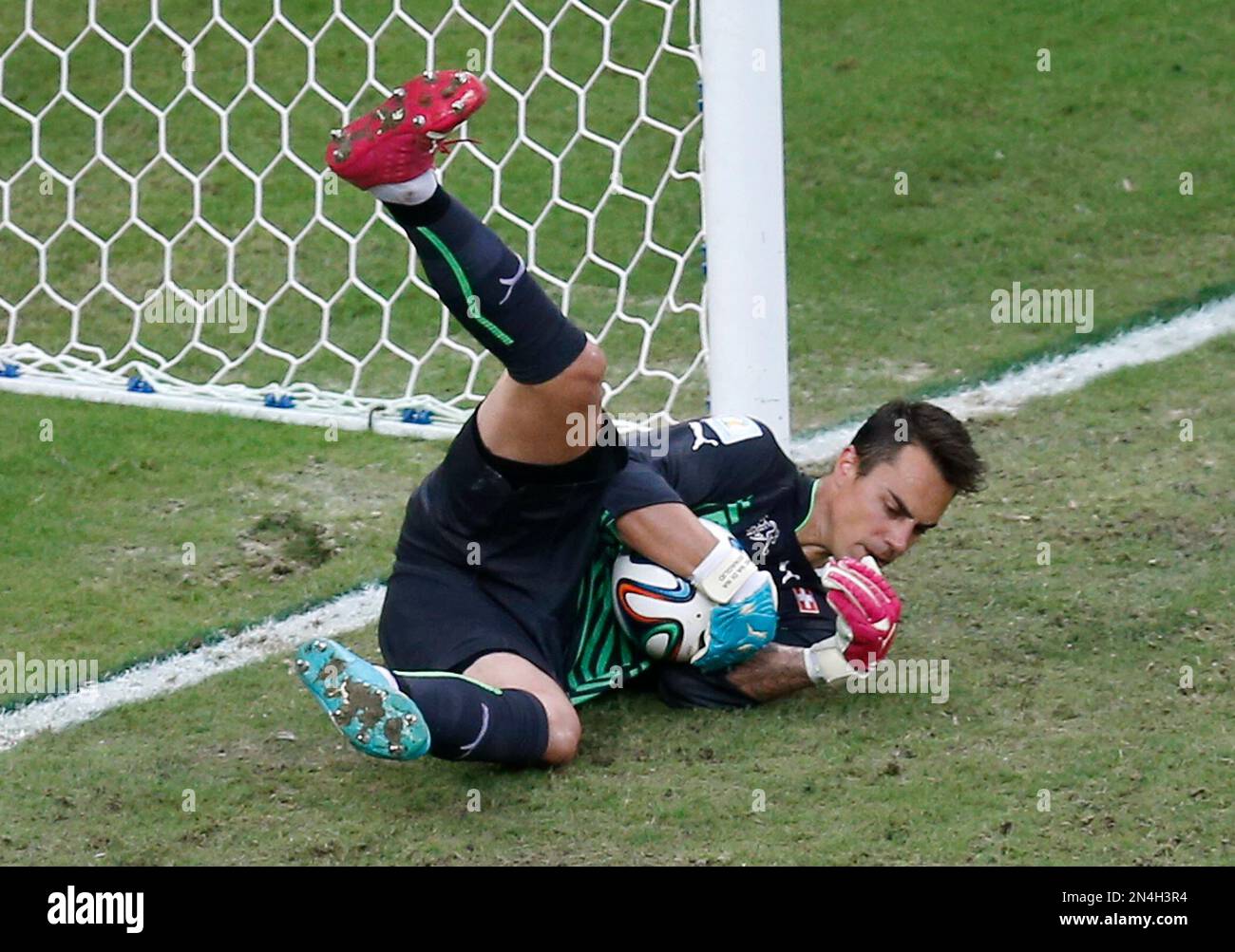 Switzerland's goalkeeper Diego Benaglio makes a save during the group E ...