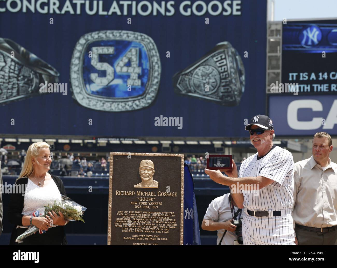 Hall of Fame relief pitcher Rich "Goose" Gossage holds up a gift from ...