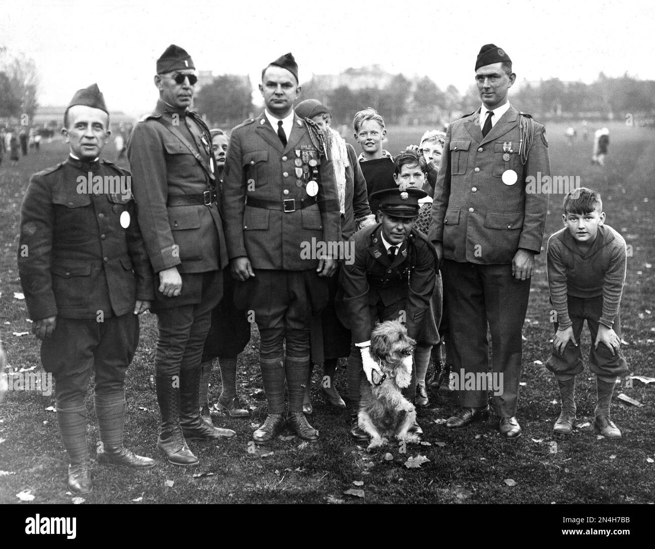 Rags, famous celebrity war dog of World War I, is shown with veterans ...