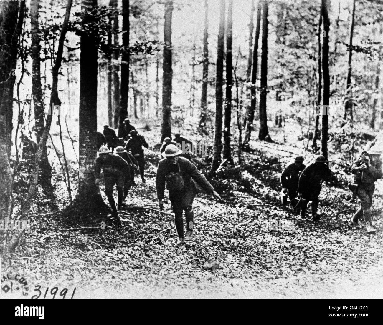 U.S. infantry advance through a crest during World War I. Date and ...