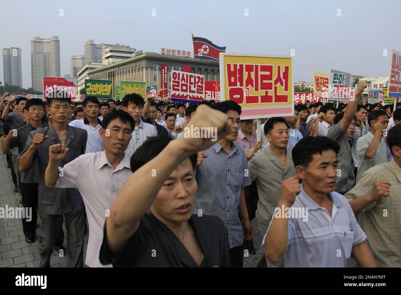 Pyongyang citizens march through the Kim Il Sung Square while chanting ...