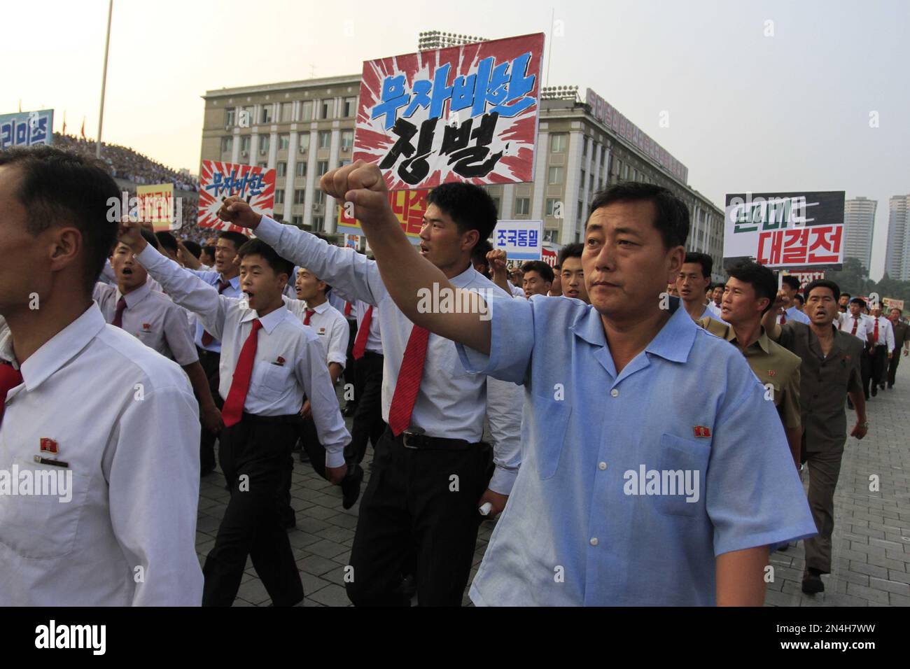Pyongyang citizens march through the Kim Il Sung Square while chanting ...