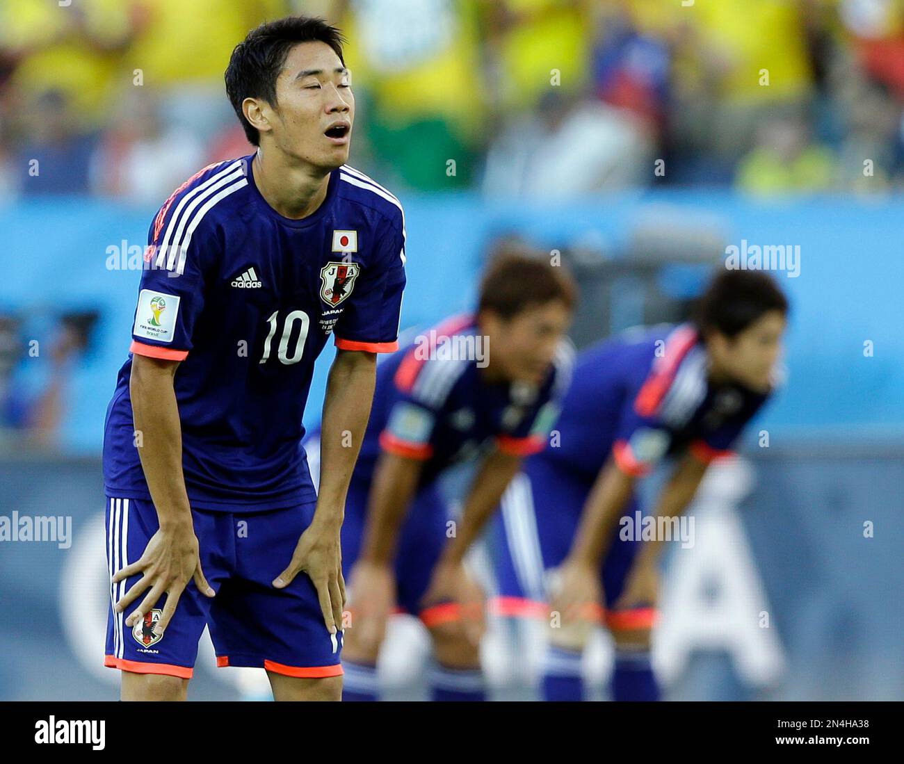 Japan's Shinji Kagawa pauses during the group C World Cup soccer match ...