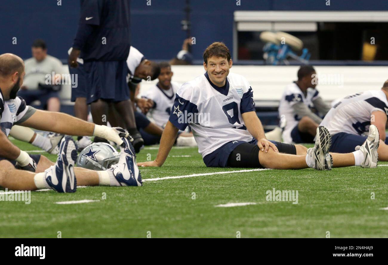 Dallas Cowboys quarterback Tony Romo (9) stretches during an NFL ...