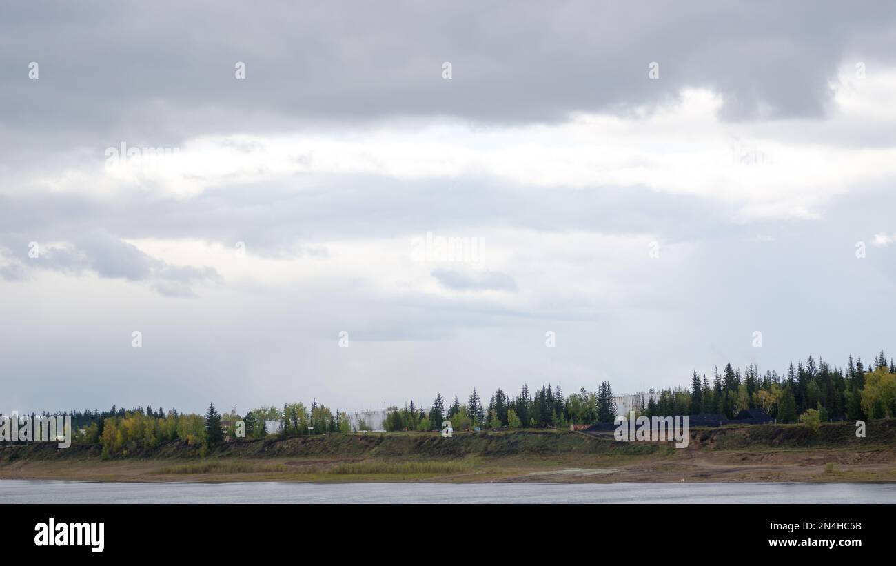 The Viluy river flows past the shore with the village of North ulus ...