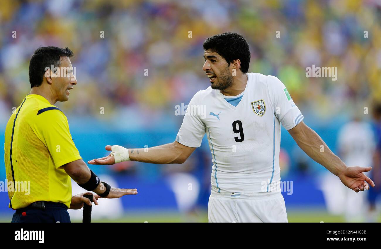 Uruguay's Luis Suarez argues with referee Marco Rodriguez from Mexico ...
