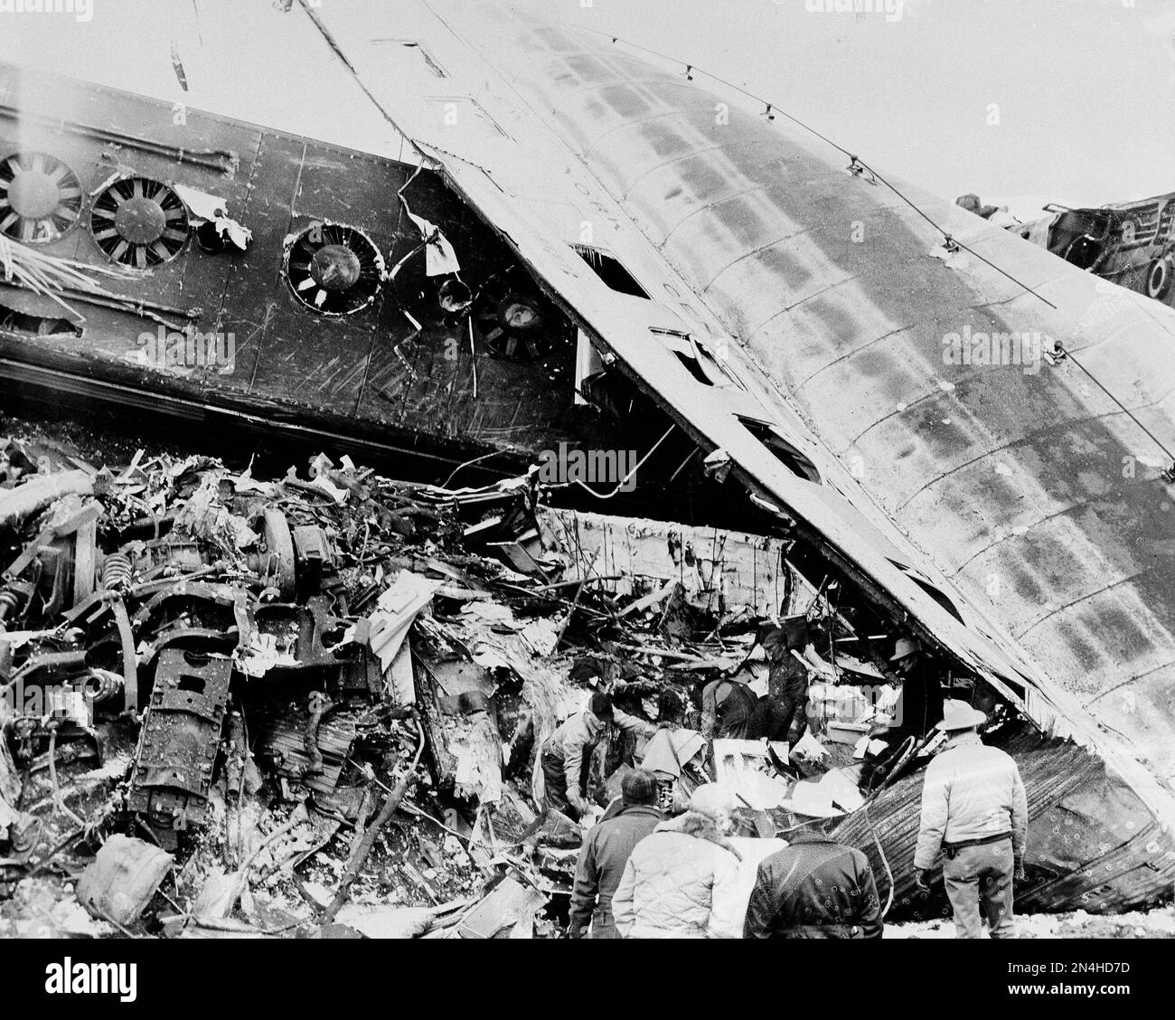 Rescuers penetrate the wreckage for dead and injured from the crash of ...