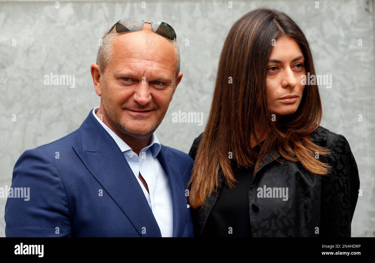 Italian actor Andrea Pucci is flanked by his unidentified partner as ...