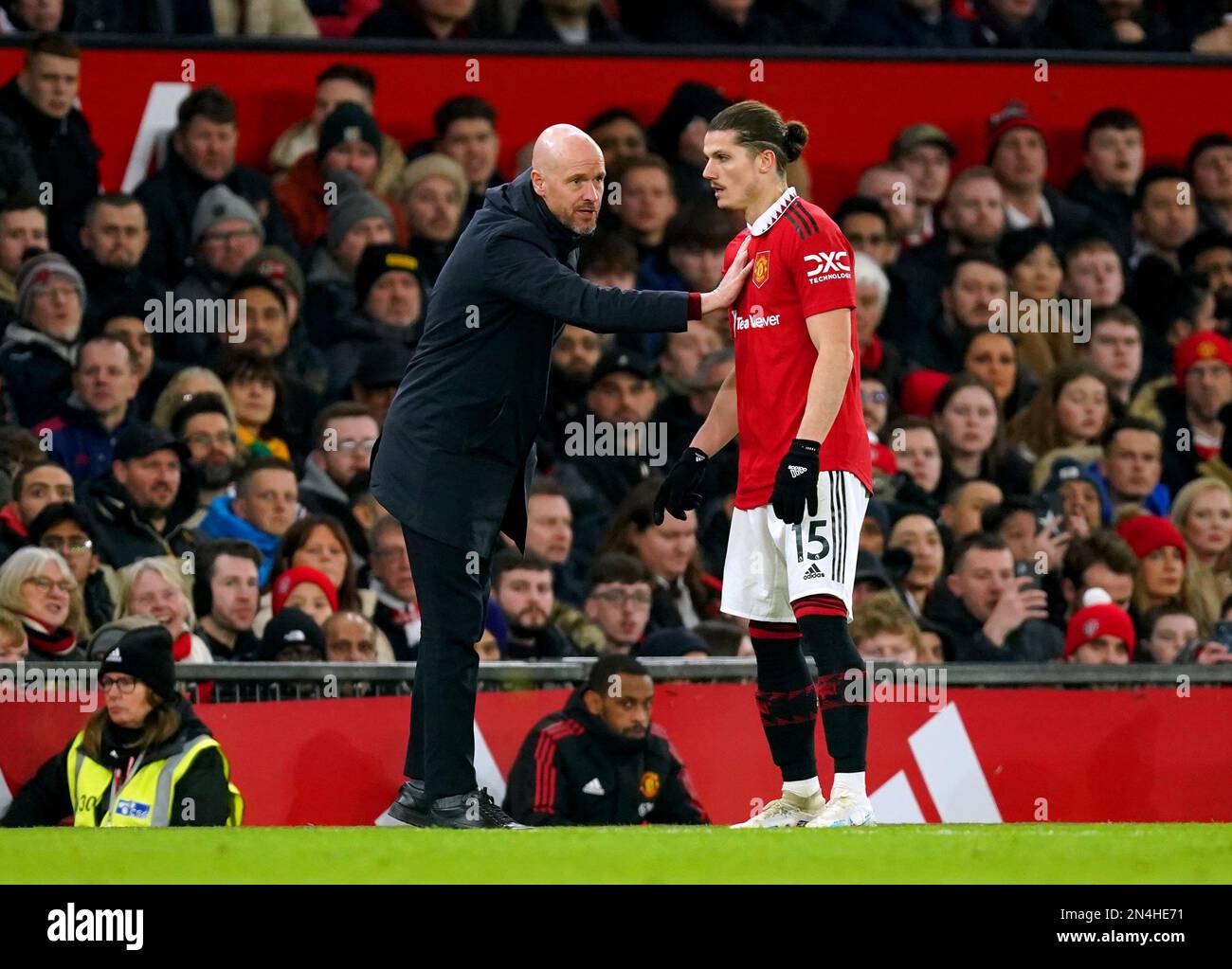 Manchester United manager Erik ten Hag (left) speaks to Marcel Sabitzer ...