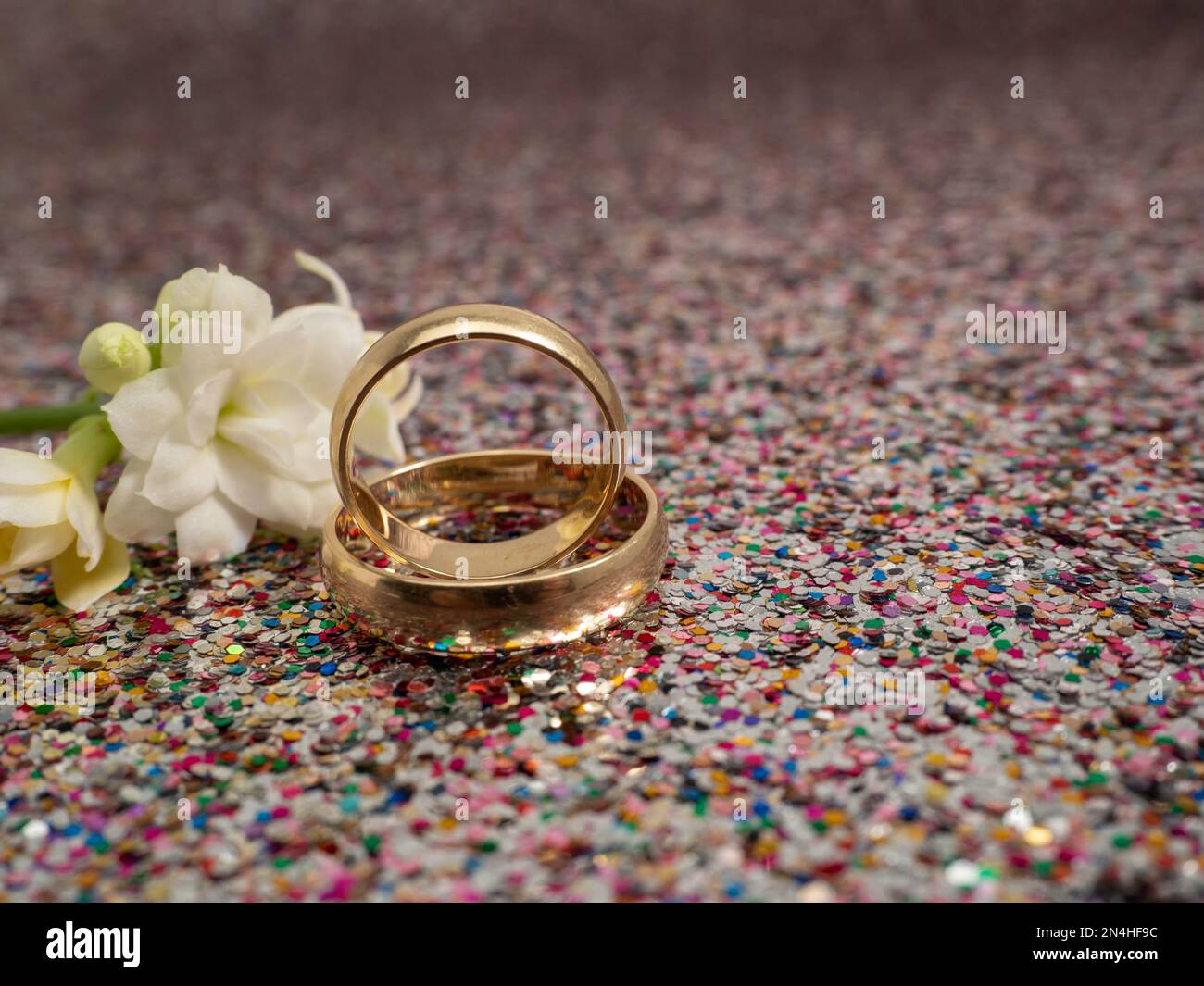 Wedding rings on a shiny background. Gold rings. Close-up Stock Photo ...