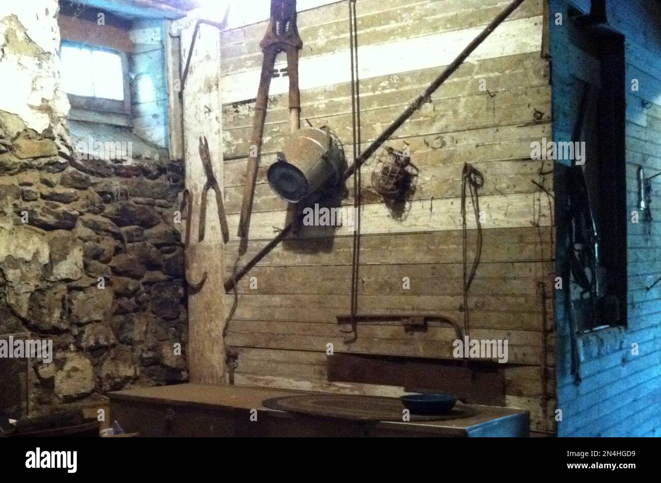 This May 28, 2014 photo shows a bucket hanging on a barn wall at the ...