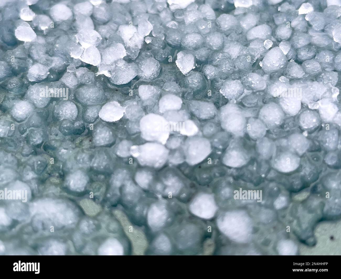 Large hailstones on a dark background. background, texture. Close-up ...
