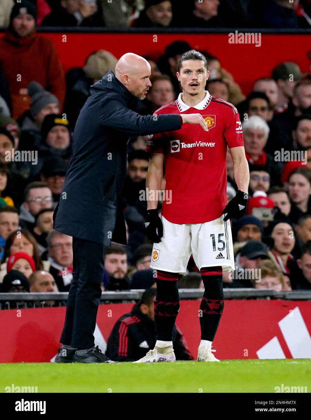 Manchester United manager Erik ten Hag (left) speaks to Marcel Sabitzer ...