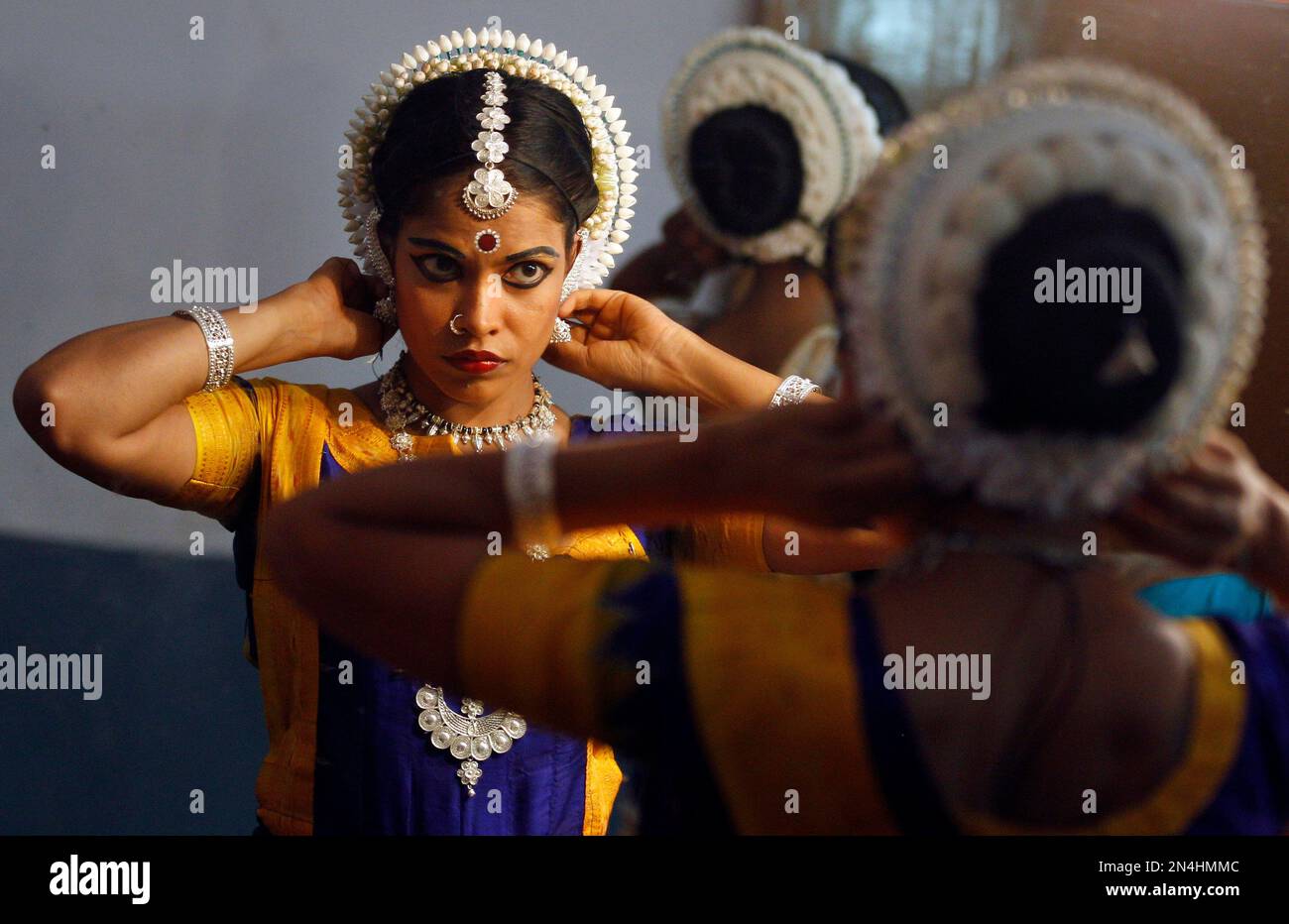 In this Sunday, June 22, 2014 photo, an Indian dancer gets ready ...