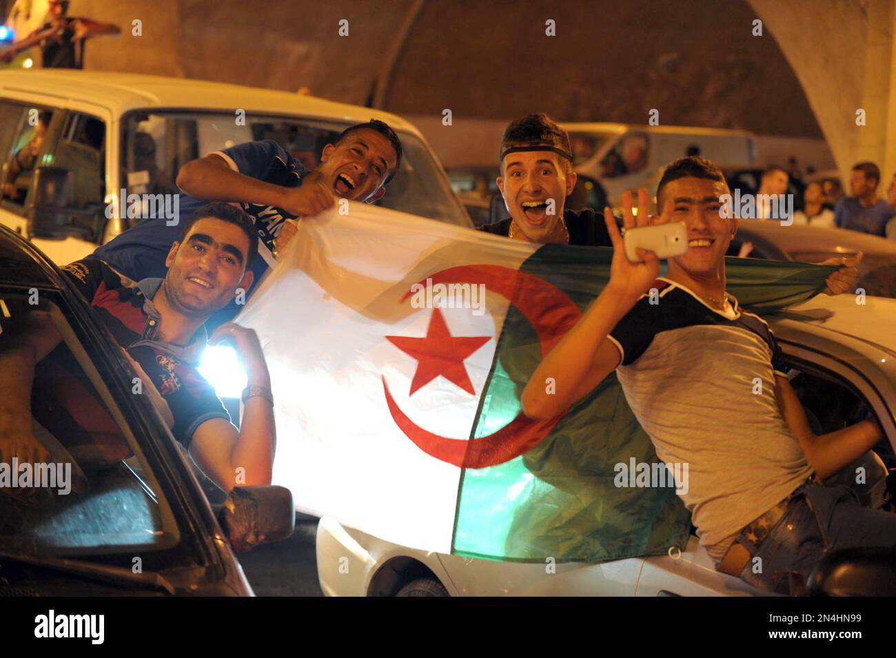 In this photo dated Tuesday, June 22, 2014, Algerian soccer fans cheer ...