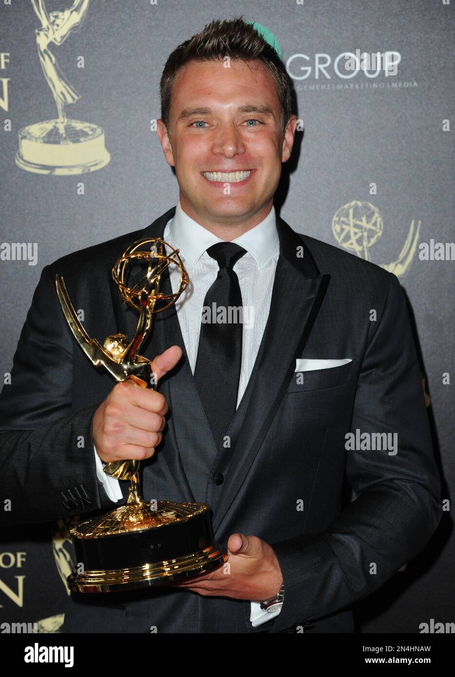 Billy Miller poses in the press room with the award for outstanding ...