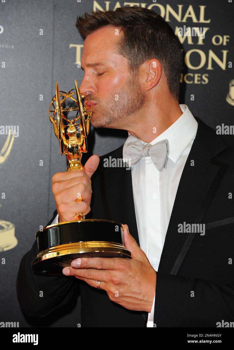 Eric Martsolf poses in the press room with the award for outstanding ...