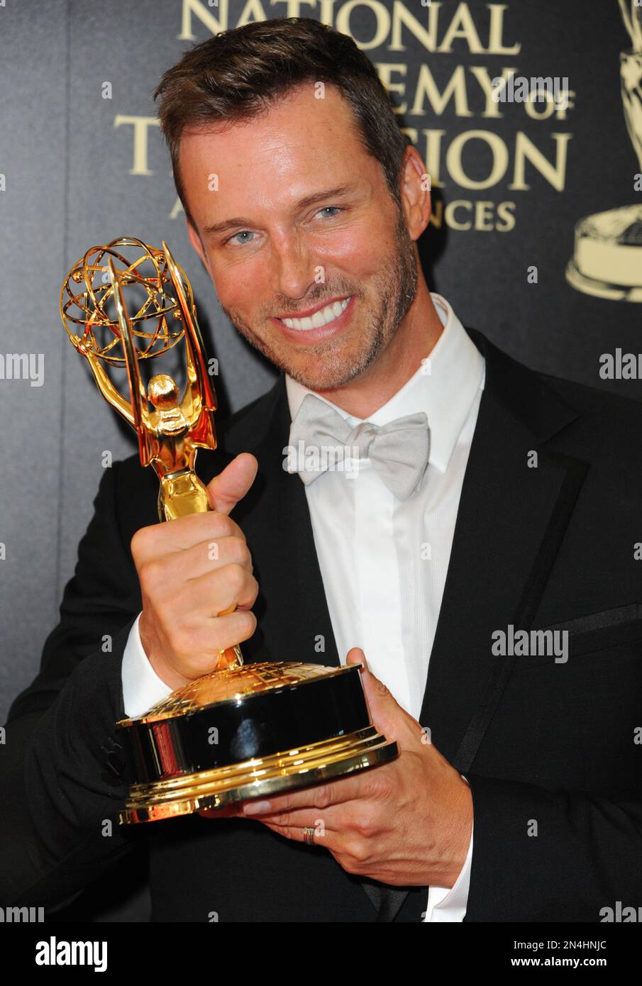 Eric Martsolf poses in the press room with the award for outstanding ...