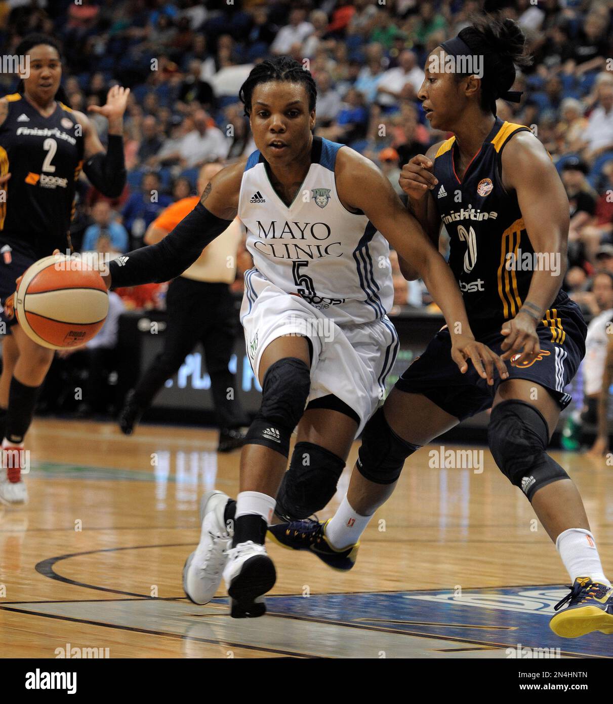 Minnesota Lynx guard Tan White, left, attempts to drive past Indiana ...