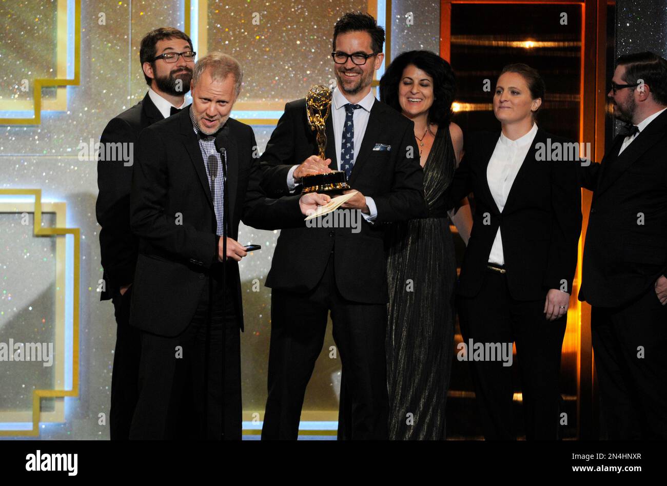 The cast of “The Mind of a Chef” accepts the award for outstanding ...