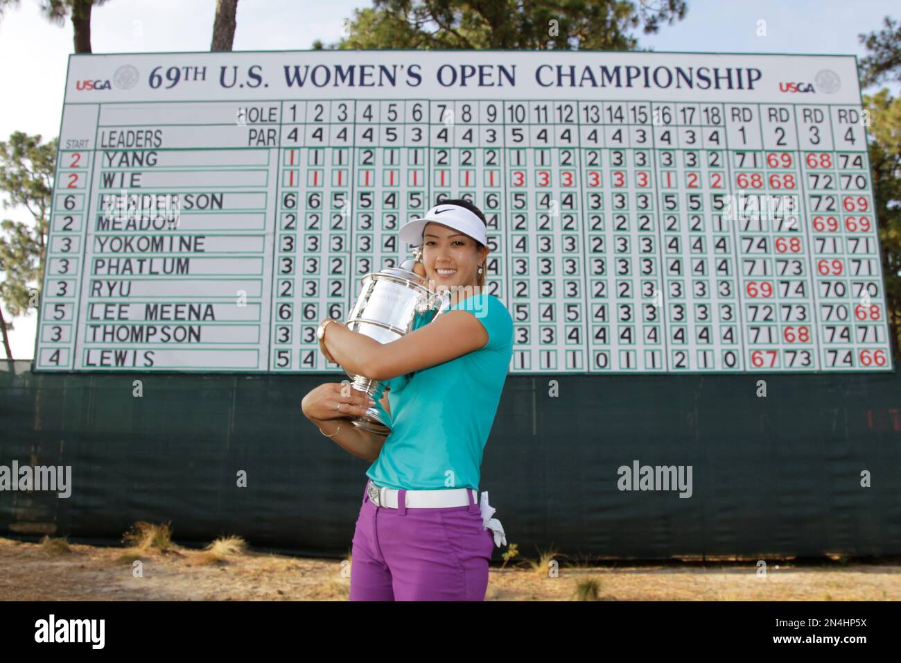 Michelle Wie pass with the trophy after winning the U.S. Women's Open ...