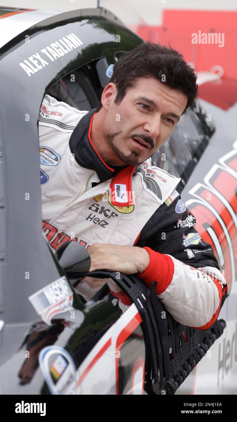 Alex Tagliani exits his race car after qualifying for the NASCAR ...