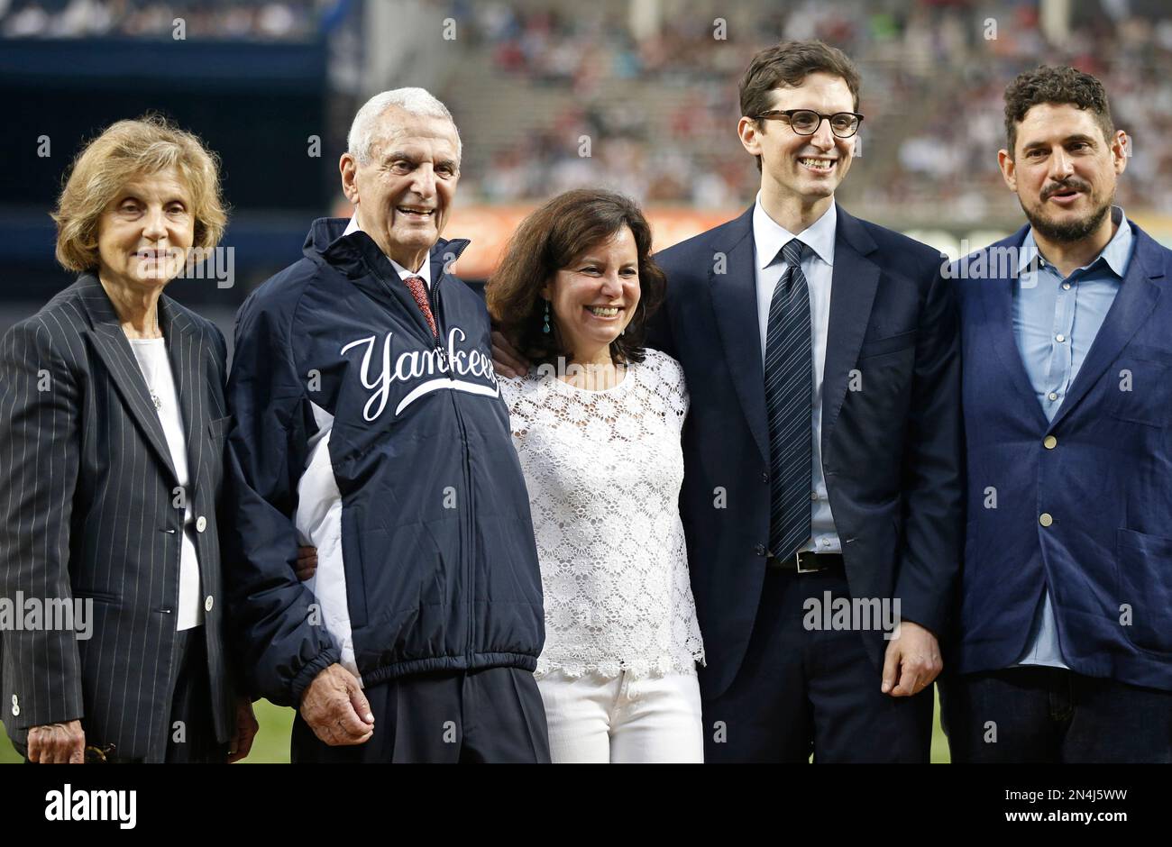 Publicist Howard J. Rubenstein, second from left, poses for a photo ...