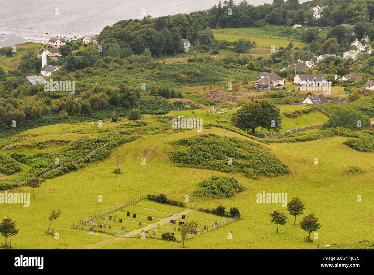 Looking down from a viewpoint to Dervaig, Mull, Scotland, showing a ...
