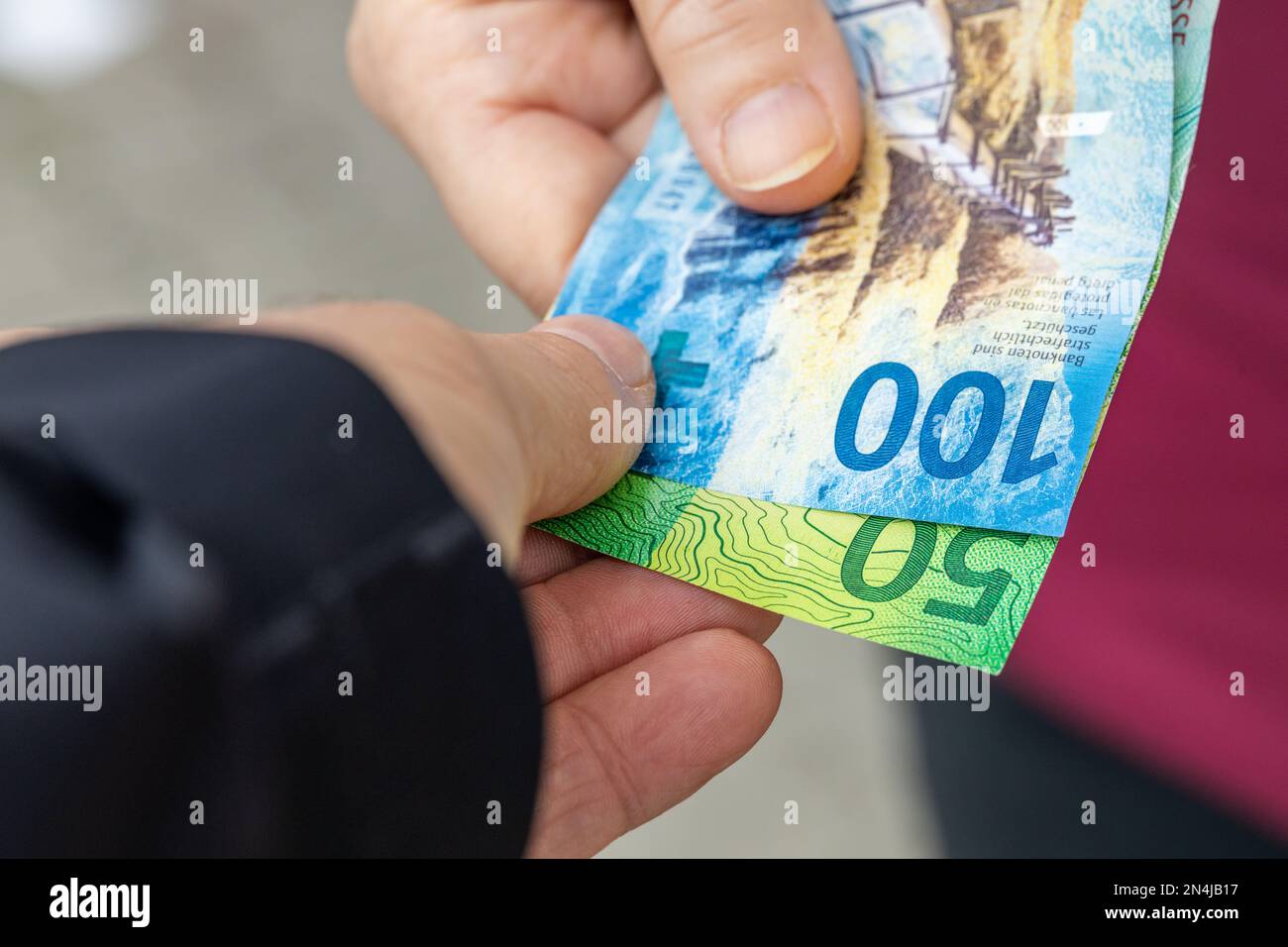 Swiss money passing from hand to hand, Handing over Swiss francs, Cash ...