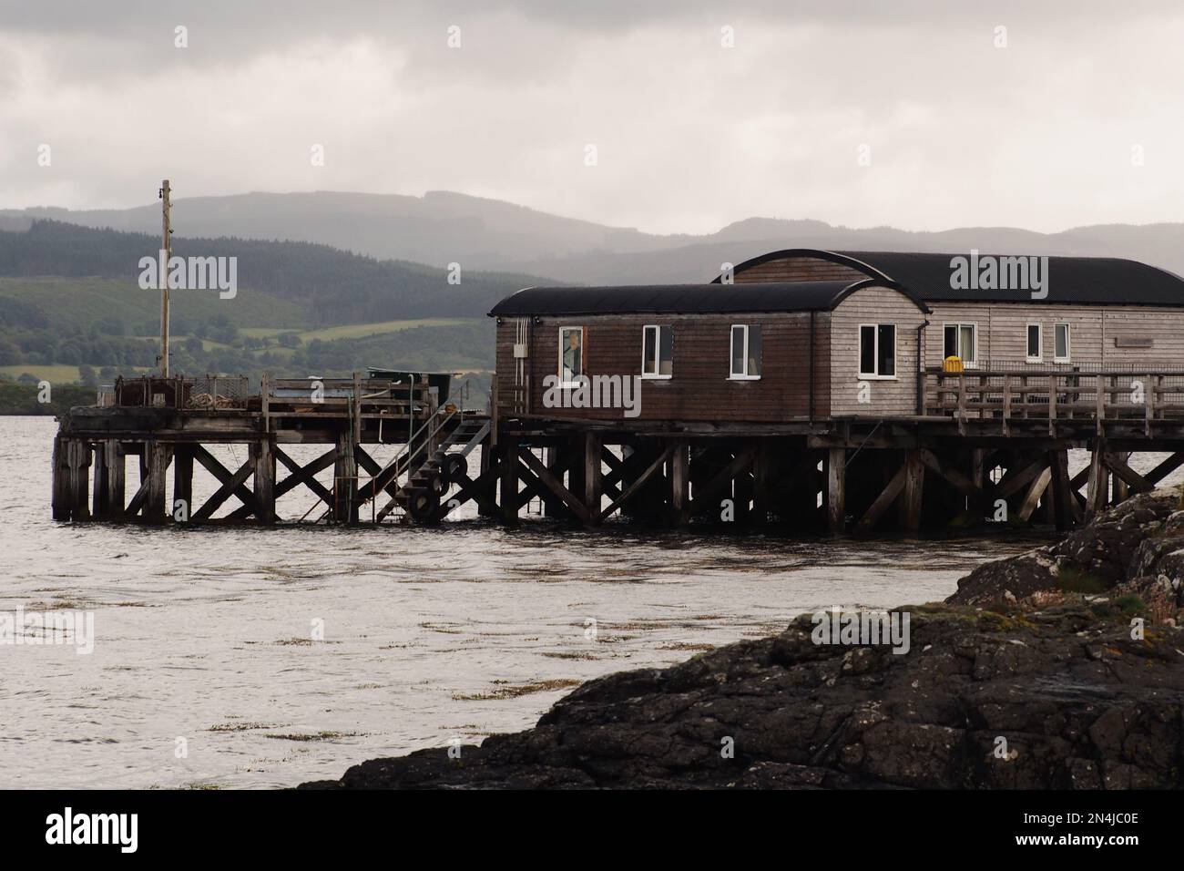 Salen pier, Salen, Mull, Scotland with holiday let building Stock Photo ...