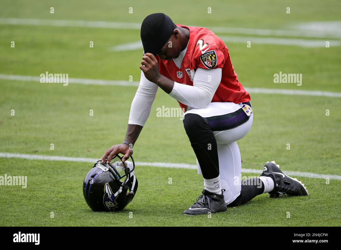 Baltimore Ravens quarterback Tyrod Taylor pauses after an NFL football ...