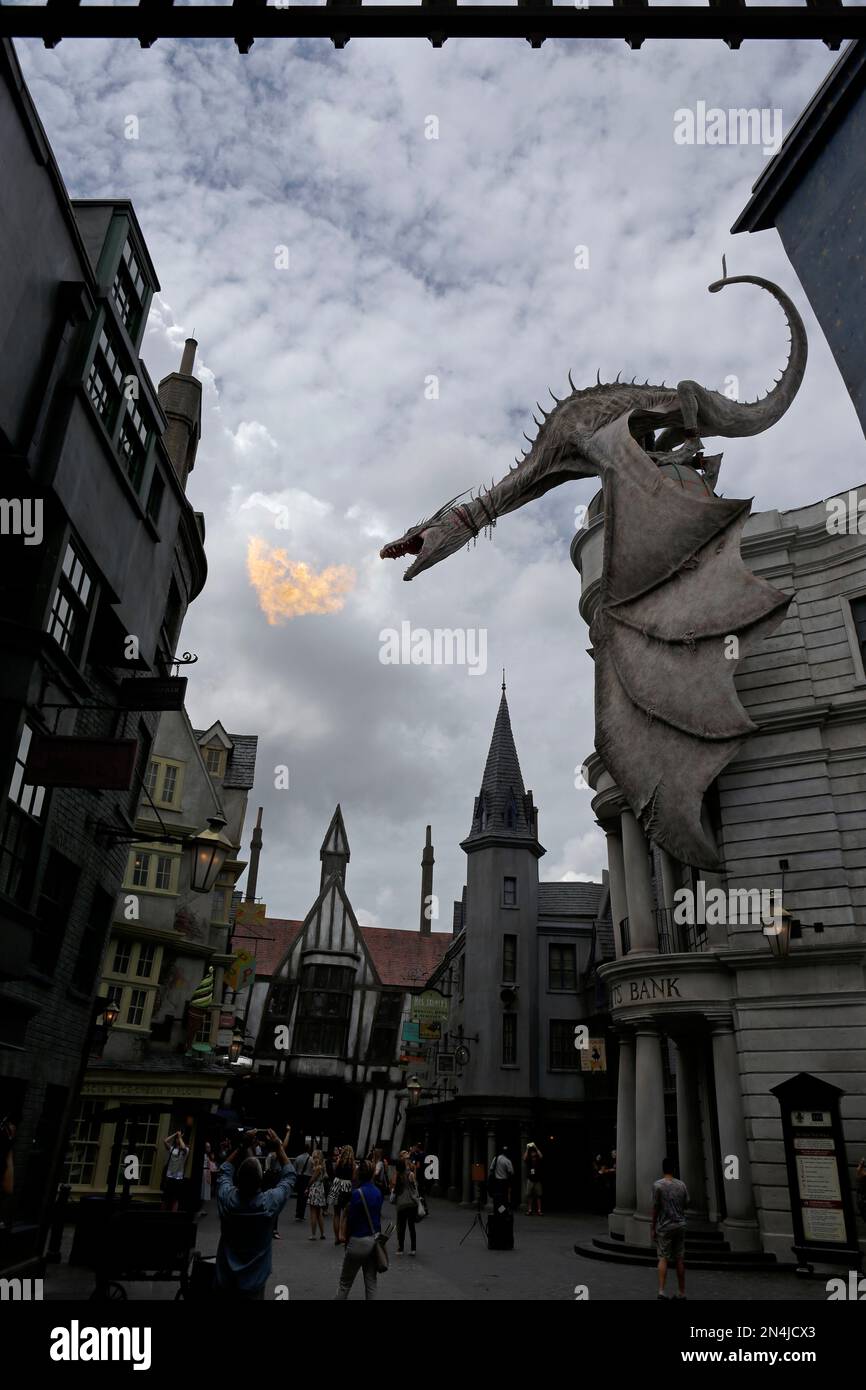 A dragon breathes fire from atop Gringnotts Bank during a preview of ...