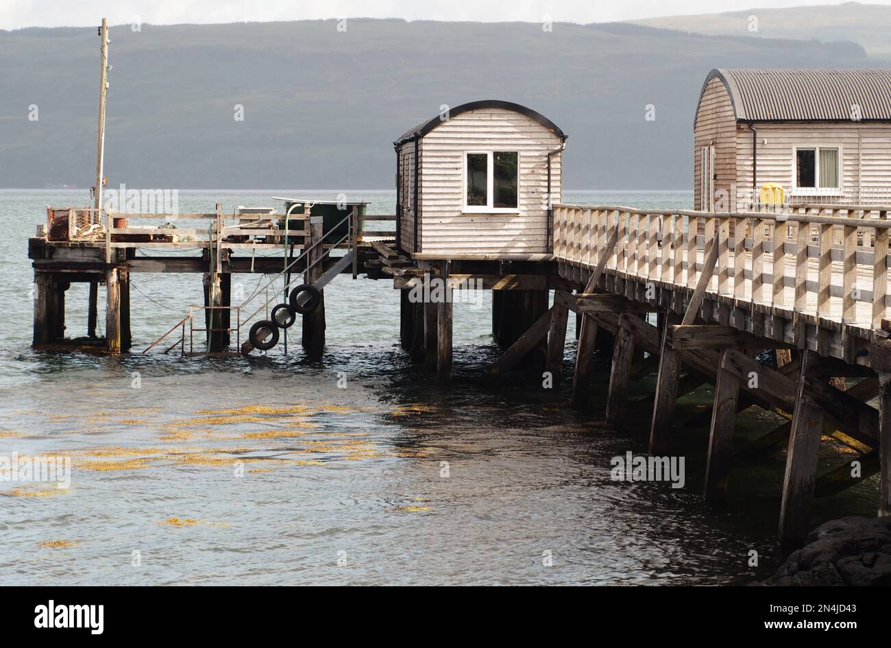 Salen pier, Salen, Mull, Scotland with holiday let building Stock Photo ...