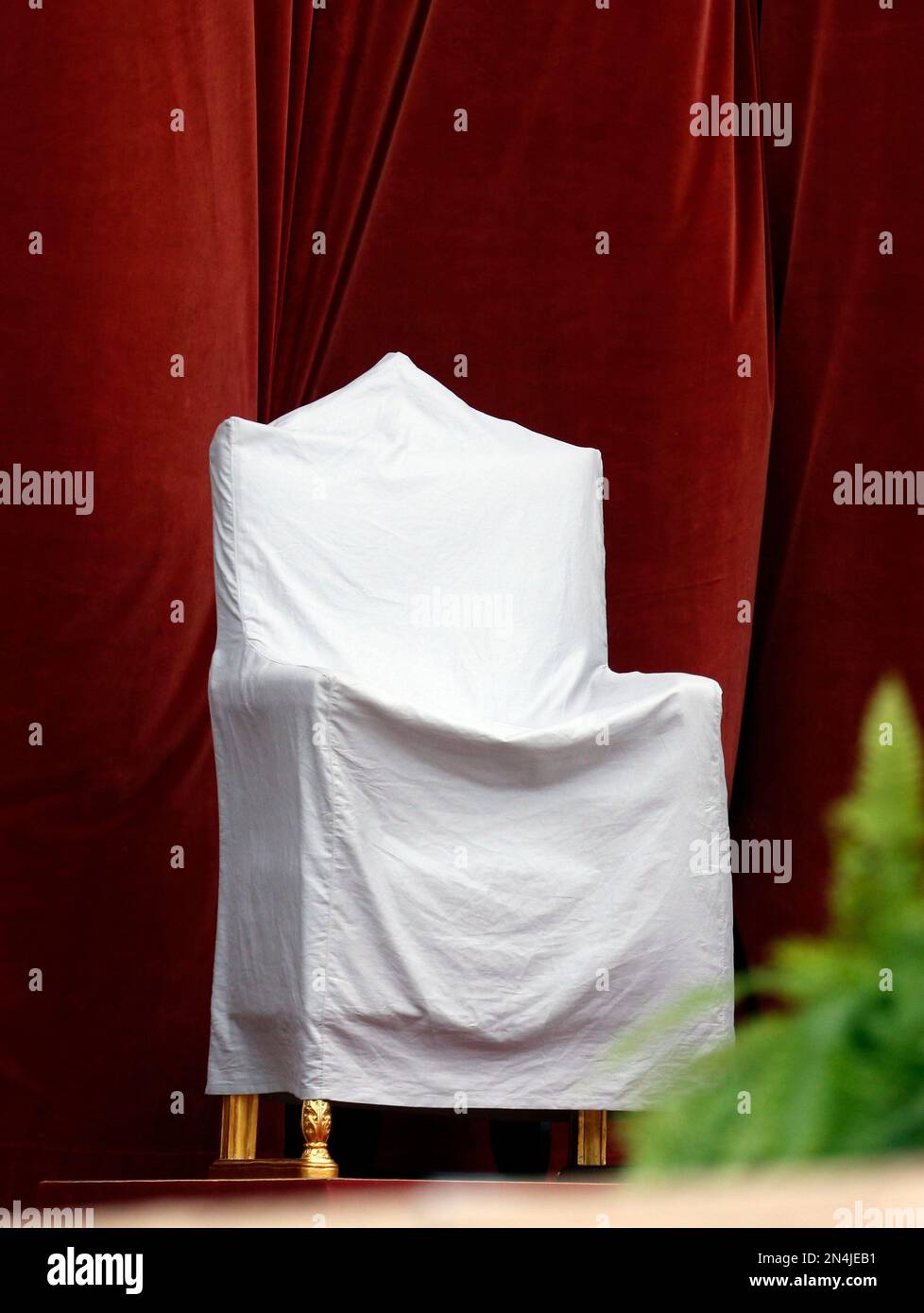 Pope Francis chair is covered prior to the start of a mass outside St ...