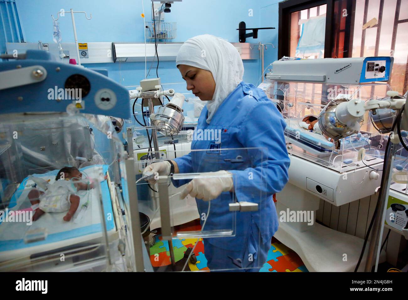 A Nurse tends to a newborn baby in Chtaura's hospital in Chtaura ...