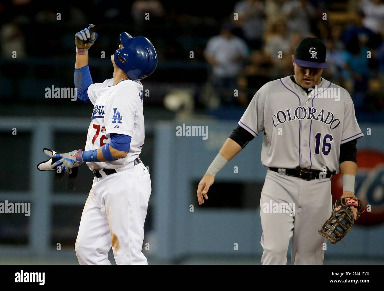 Los Angeles Dodgers' Miguel Rojas, left, celebrates his three-run ...
